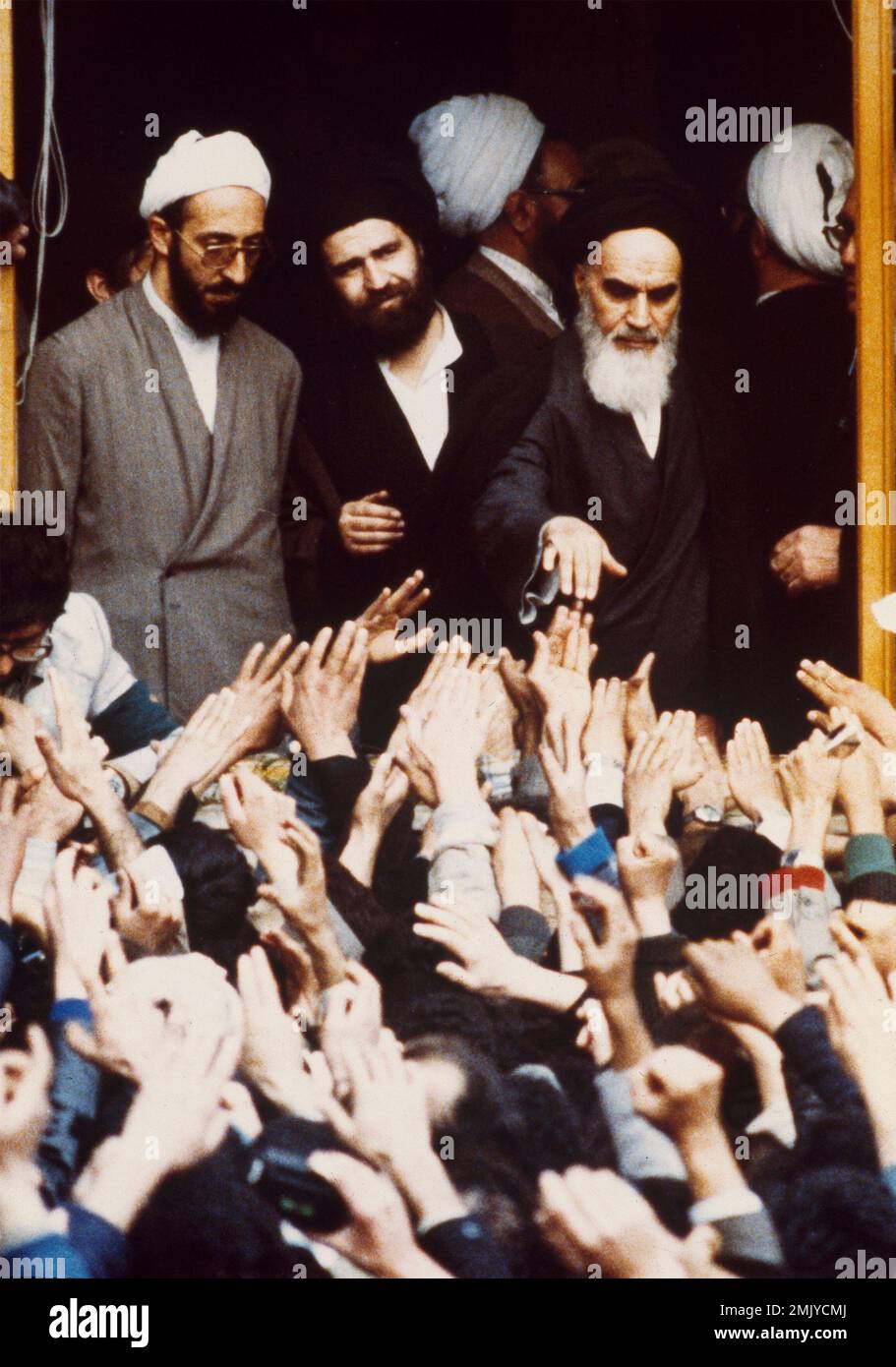 Islamic fundamentalist cleric Ayatollah Ruhollah Khomeini, right ...