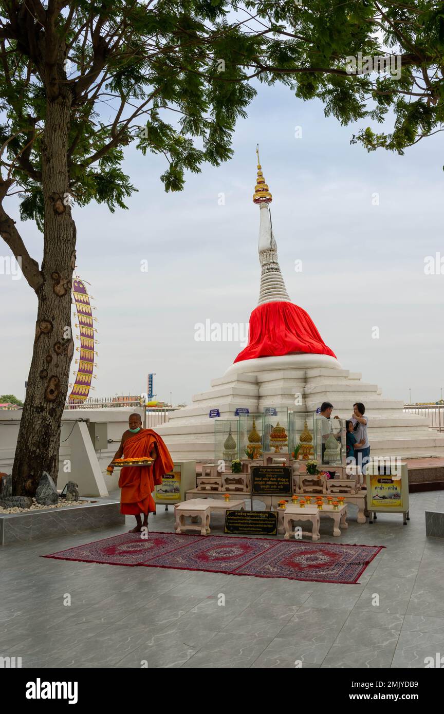 A working Buddhist Monk at the leaning Mon Pagoda Rim on the Chao ...