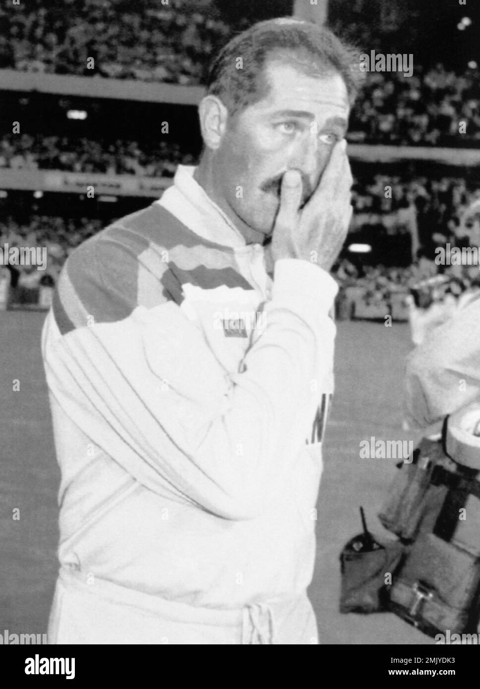 England cricket captain Graham Gooch wipes his eyes after his team had ...