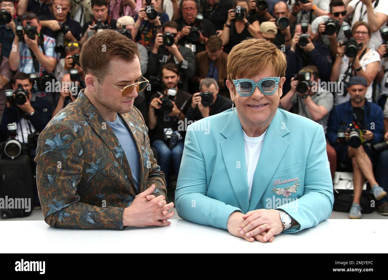 Actor Taron Egerton, left, and singer Elton John pose for photographers ...