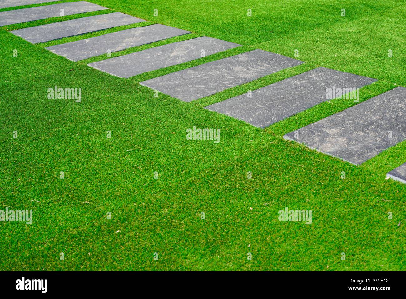 Zen stone path way in Japanese steps Garden with green synthetic grass ...