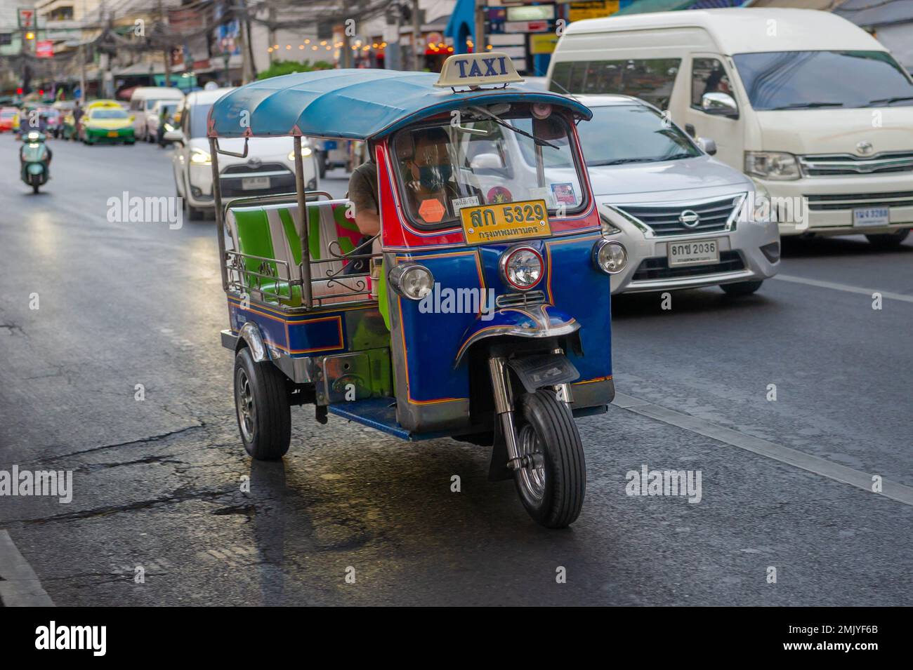 A moving Tuk Tuk on the Chakrabongse Road, Bangkok, Thailand Stock ...