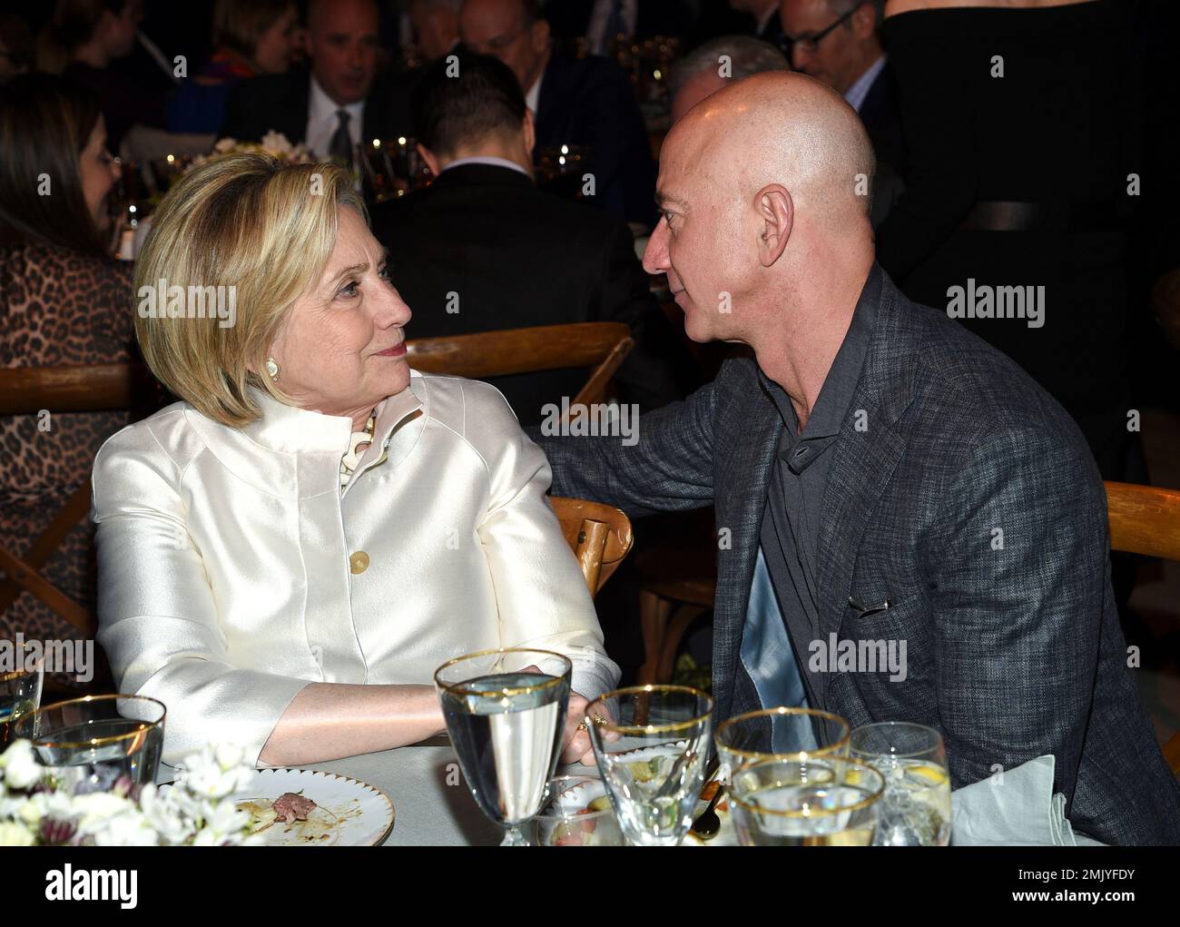 Former Secretary of State Hillary Clinton, left, and Amazon CEO Jeff ...