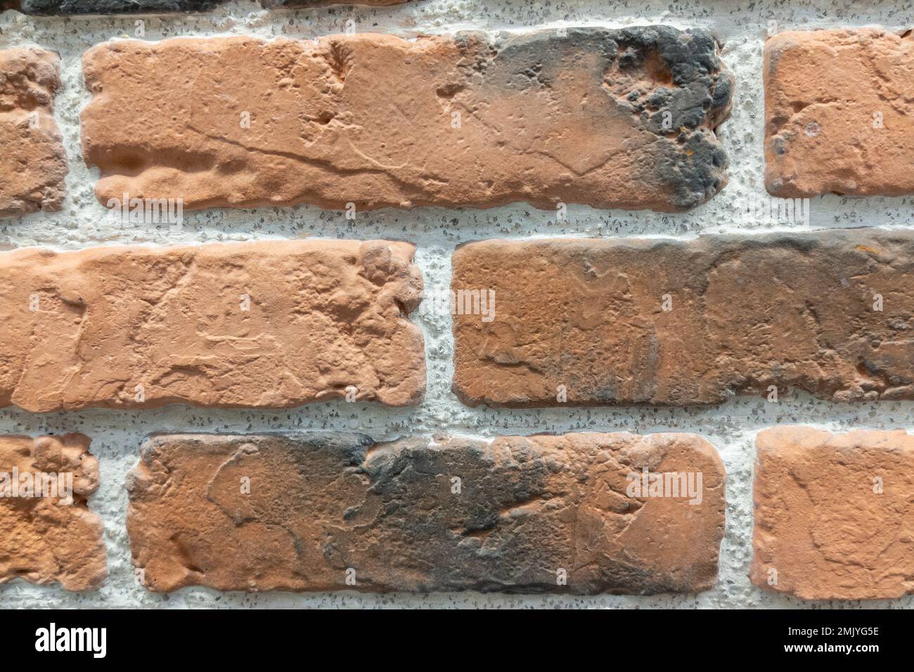 facade Brick wall background of bricks building horizontal stones ...