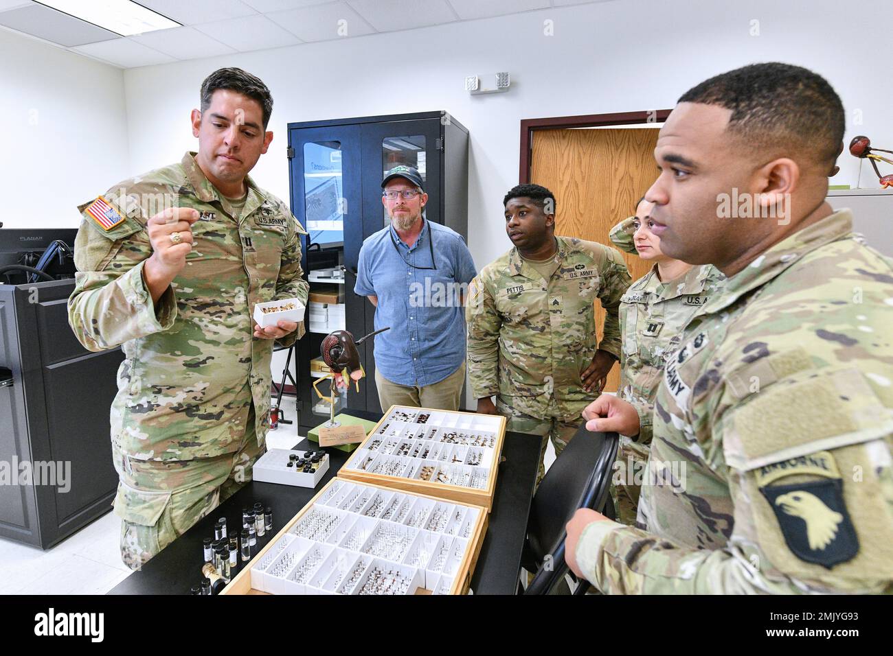 U.S. Army Cpt. Paul Lenhart, a 72B entomologist assigned to the Public ...