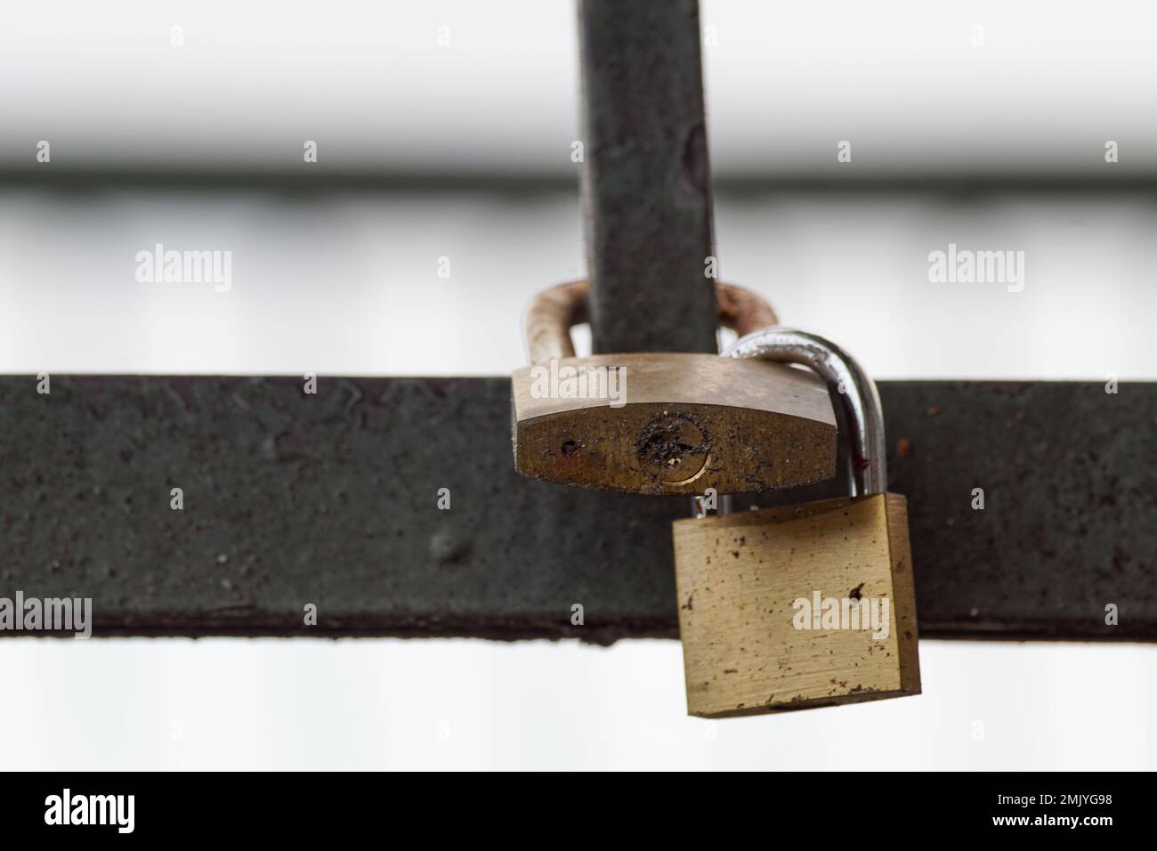 Padlocks hanging on iron fence hi-res stock photography and images - Alamy