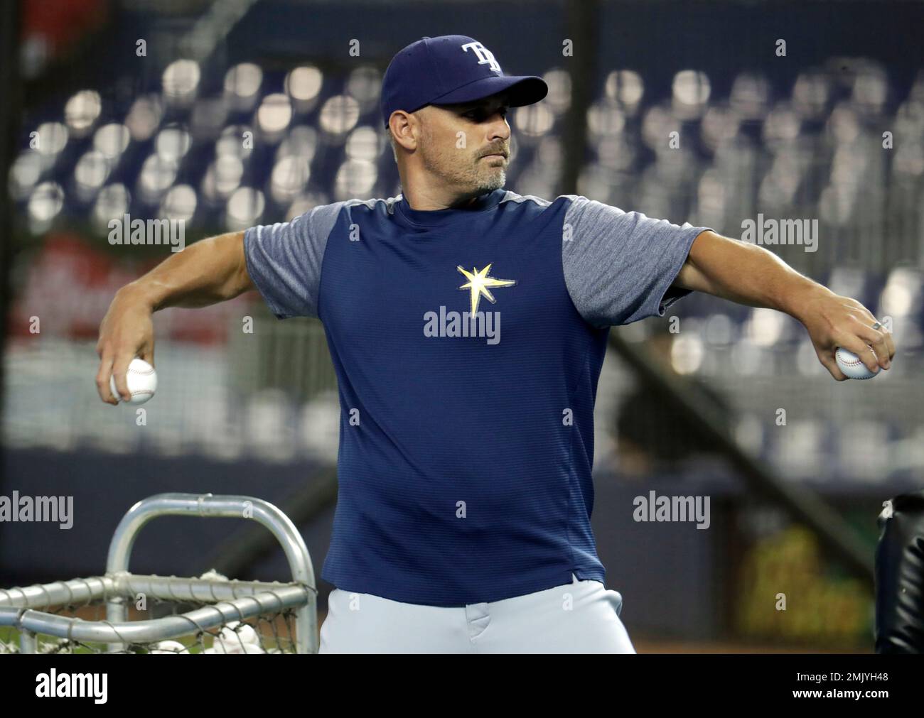 Tampa Bay Rays manager Kevin Cash throws batting practice before a ...