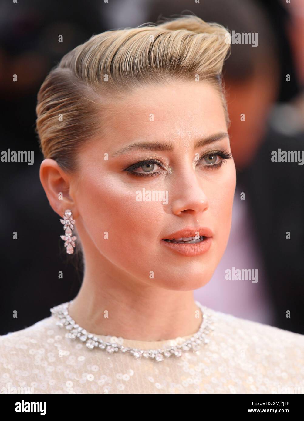 Actress Amber Heard poses for photographers upon arrival at the ...