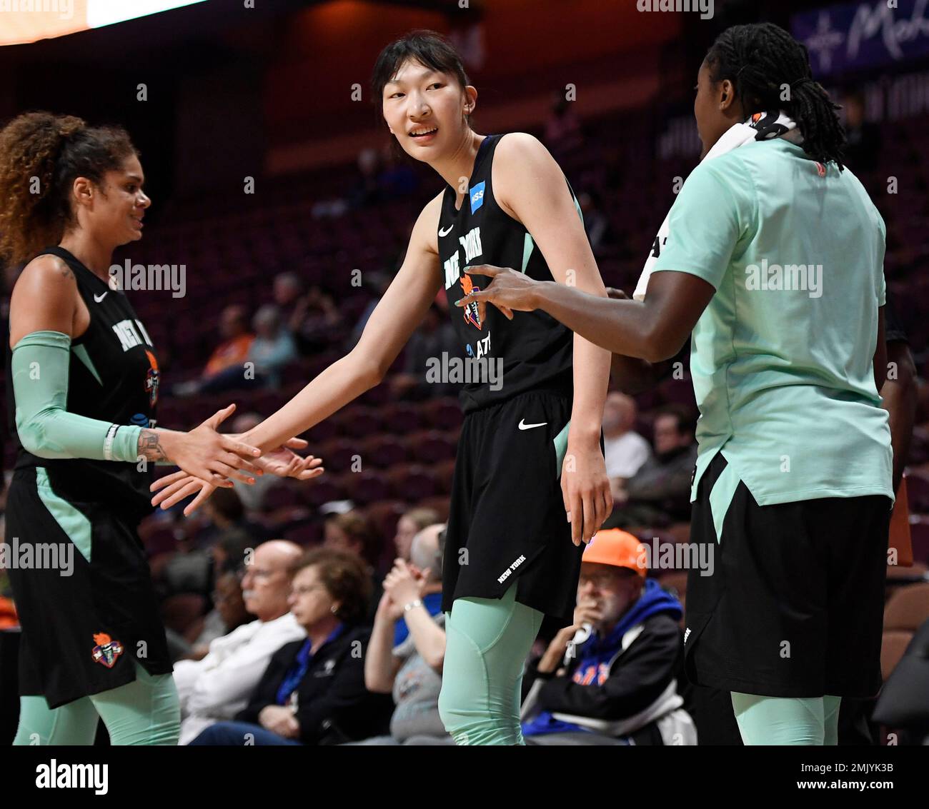 New York Liberty's Han Xu of China, center, talks with teammate Tina ...