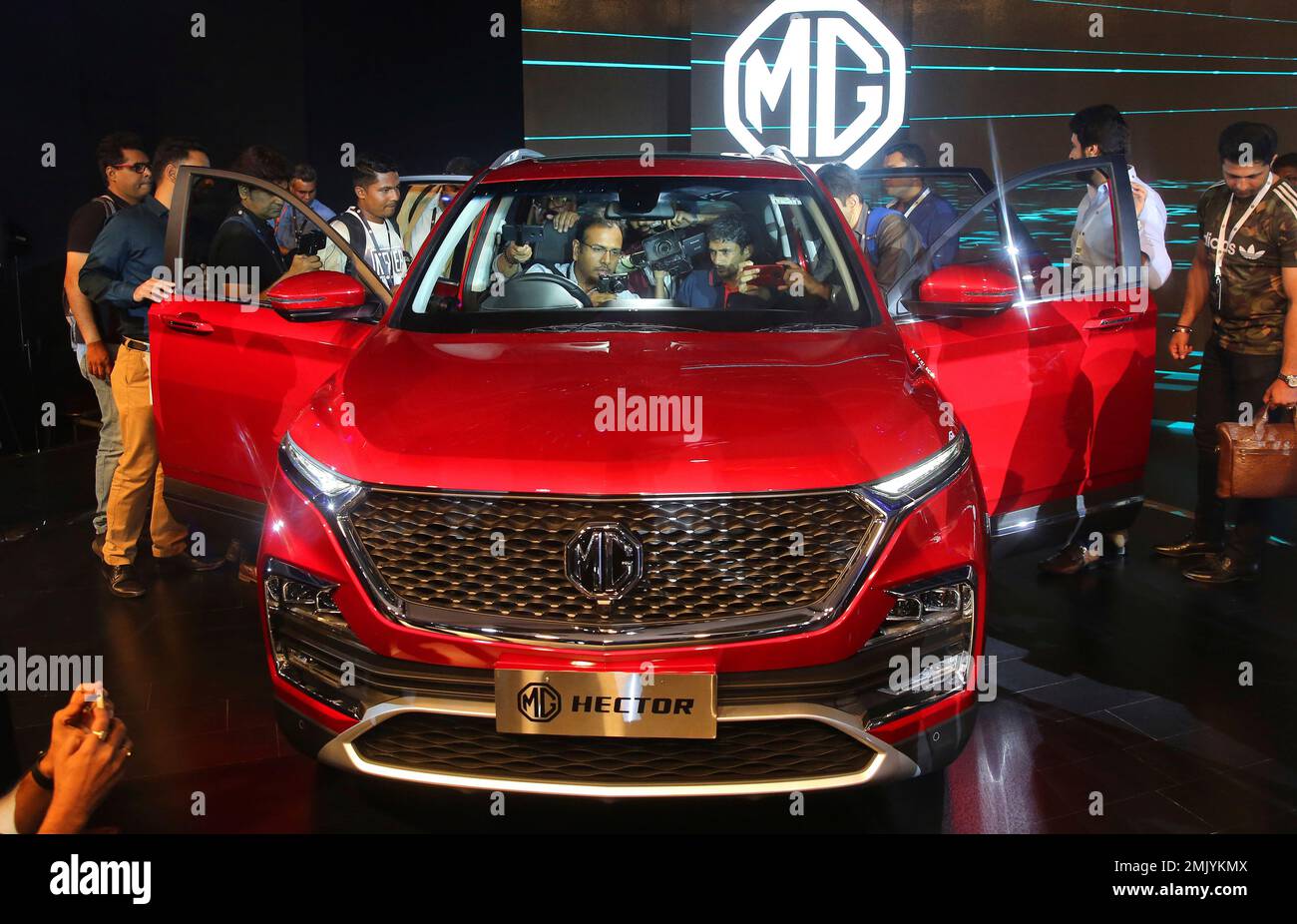 Cameramen film the interior of Morris Garages (MG) Motor India's new ...