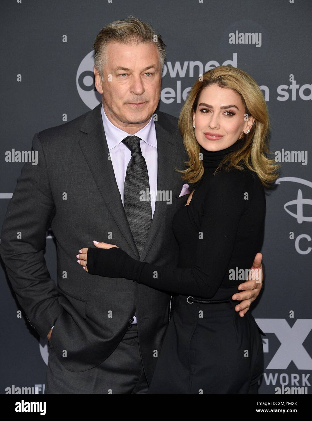 Alec Baldwin, left, and wife Hilaria Baldwin attend the Walt Disney ...