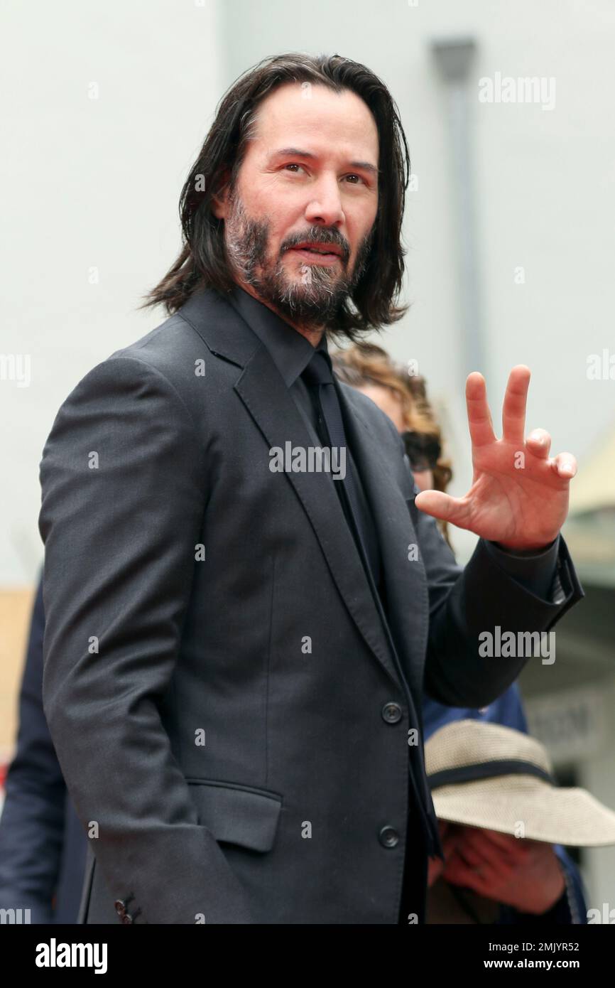 Keanu Reeves arrives at a hand and footprint ceremony honoring him at ...