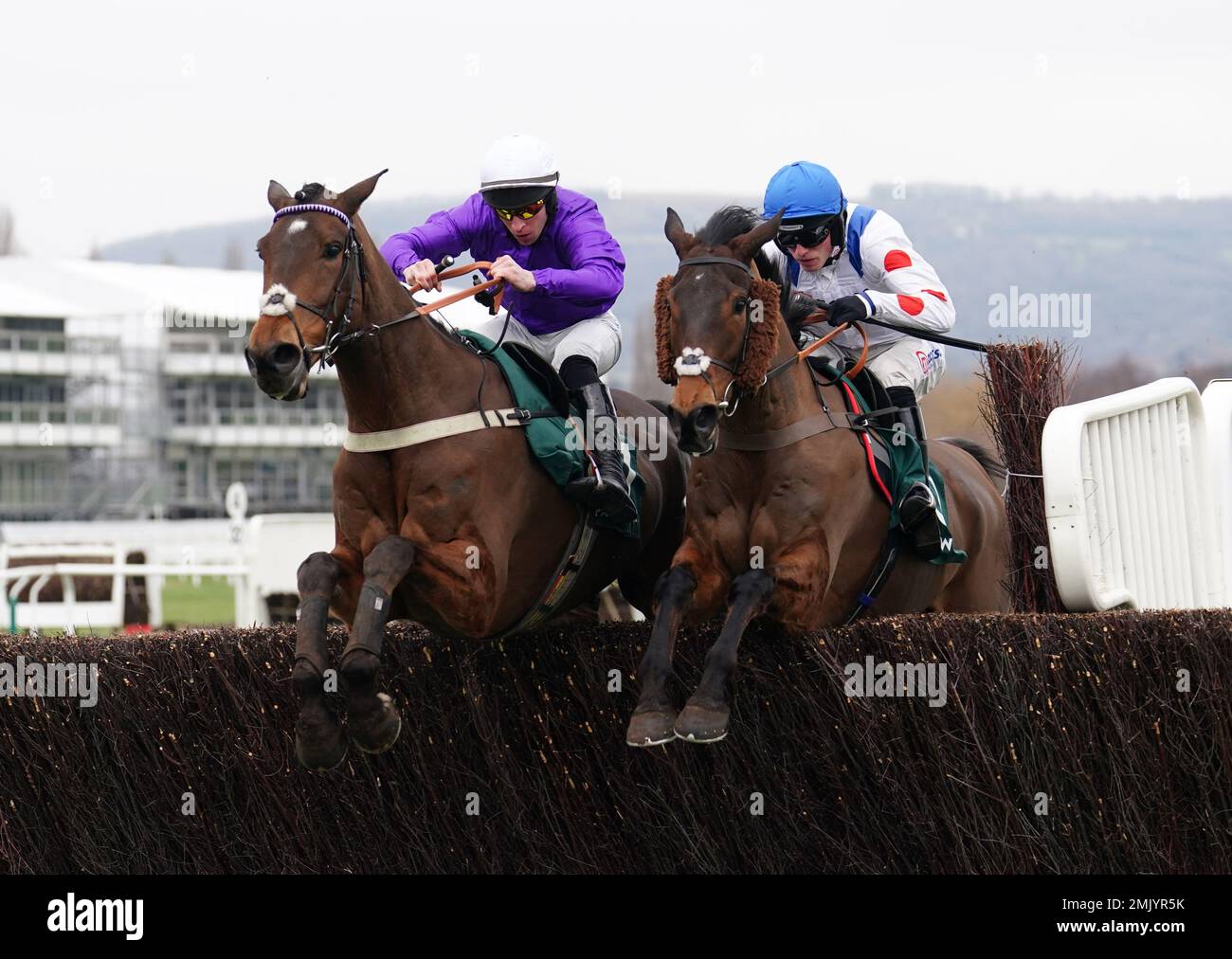 Il Ridoto ridden by Harry Cobden (right) clears a fence before going on ...