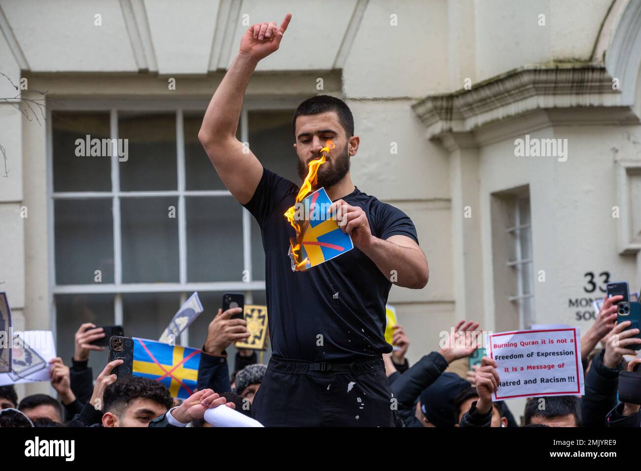London, England, UK. 28th Jan, 2023. Muslim protesters burn Swedish ...
