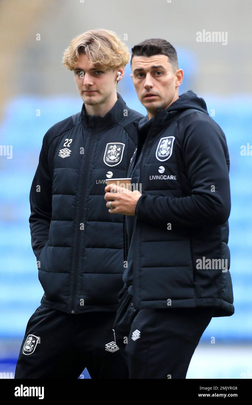 Huddersfield Town's Matthew Lowton and Jack Rudoni (left) on the pitch ...