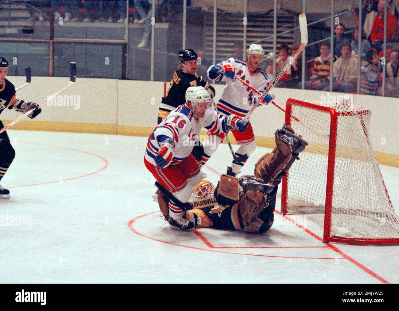 New York Rangers Marcel Dionne (16) gets tripped up by Pittsburgh ...