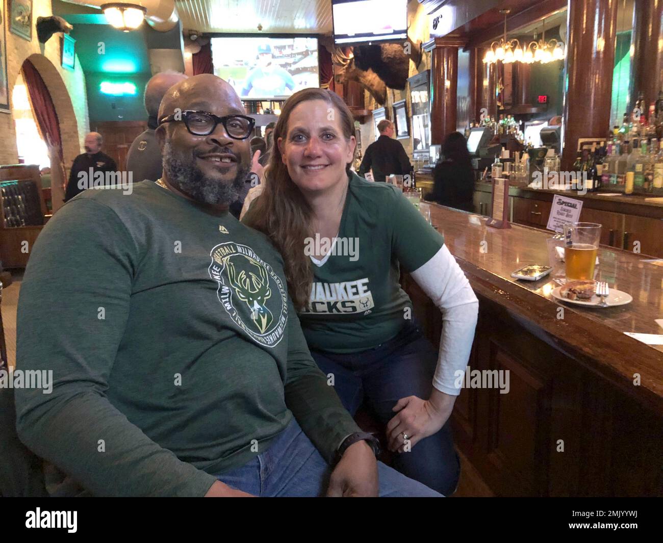 In this May 8, 2019 photo, longtime Bucks fans and season-ticket ...