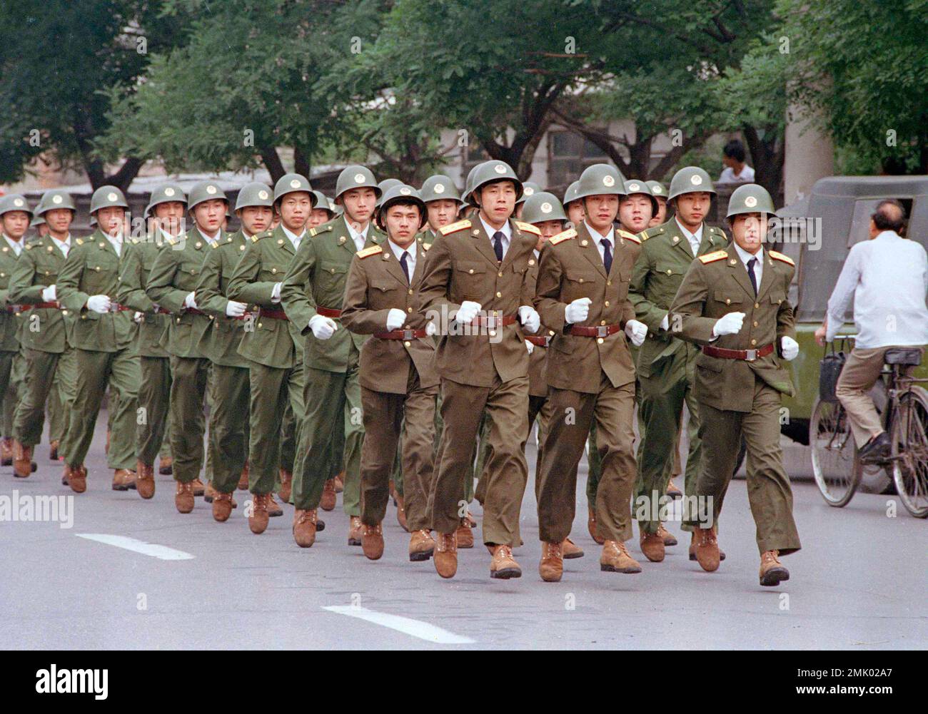 Chinese army troops from the party headquarters garrison jog in ...