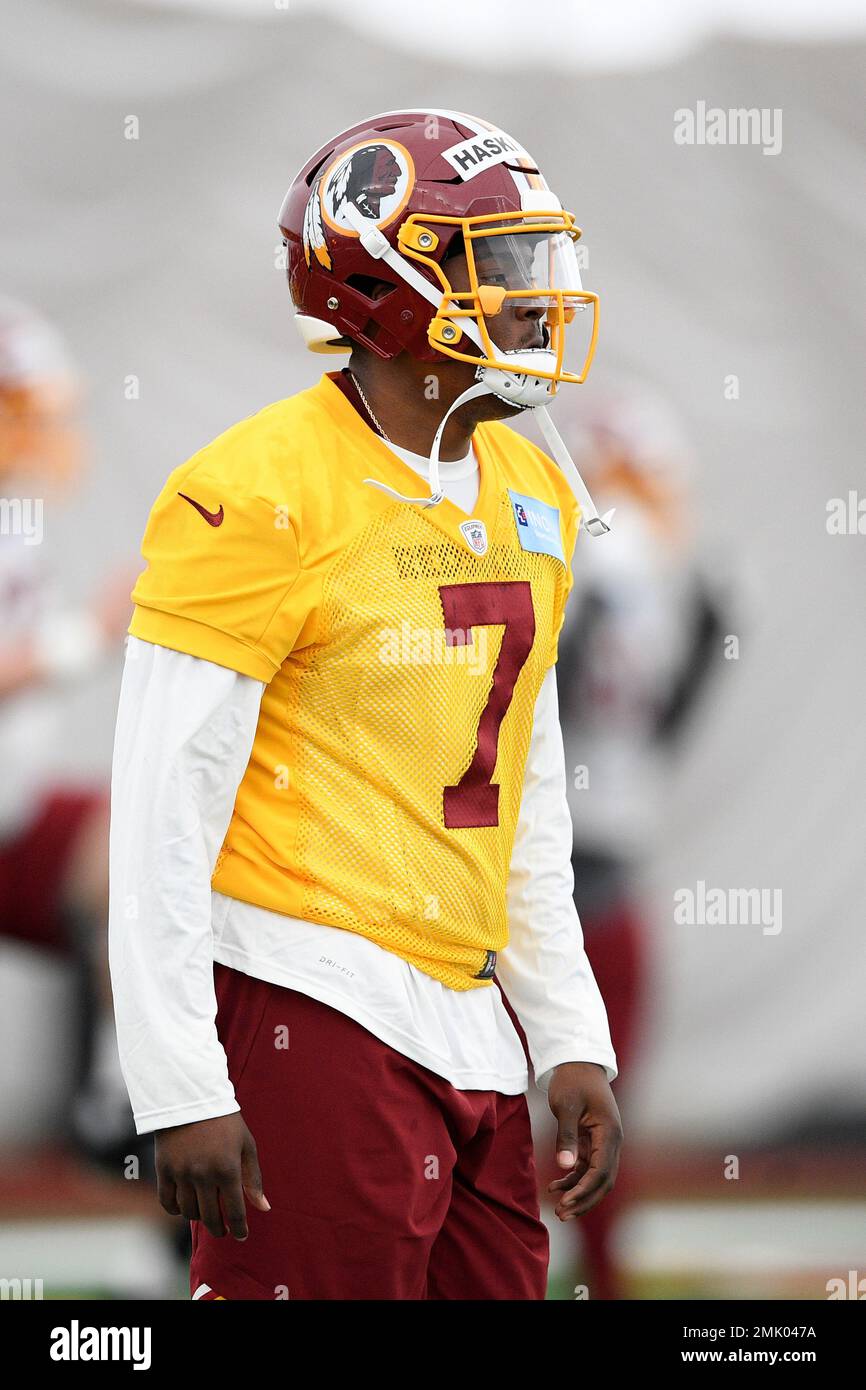 Washington Redskins quarterback Dwayne Haskins Jr. stands on the field ...