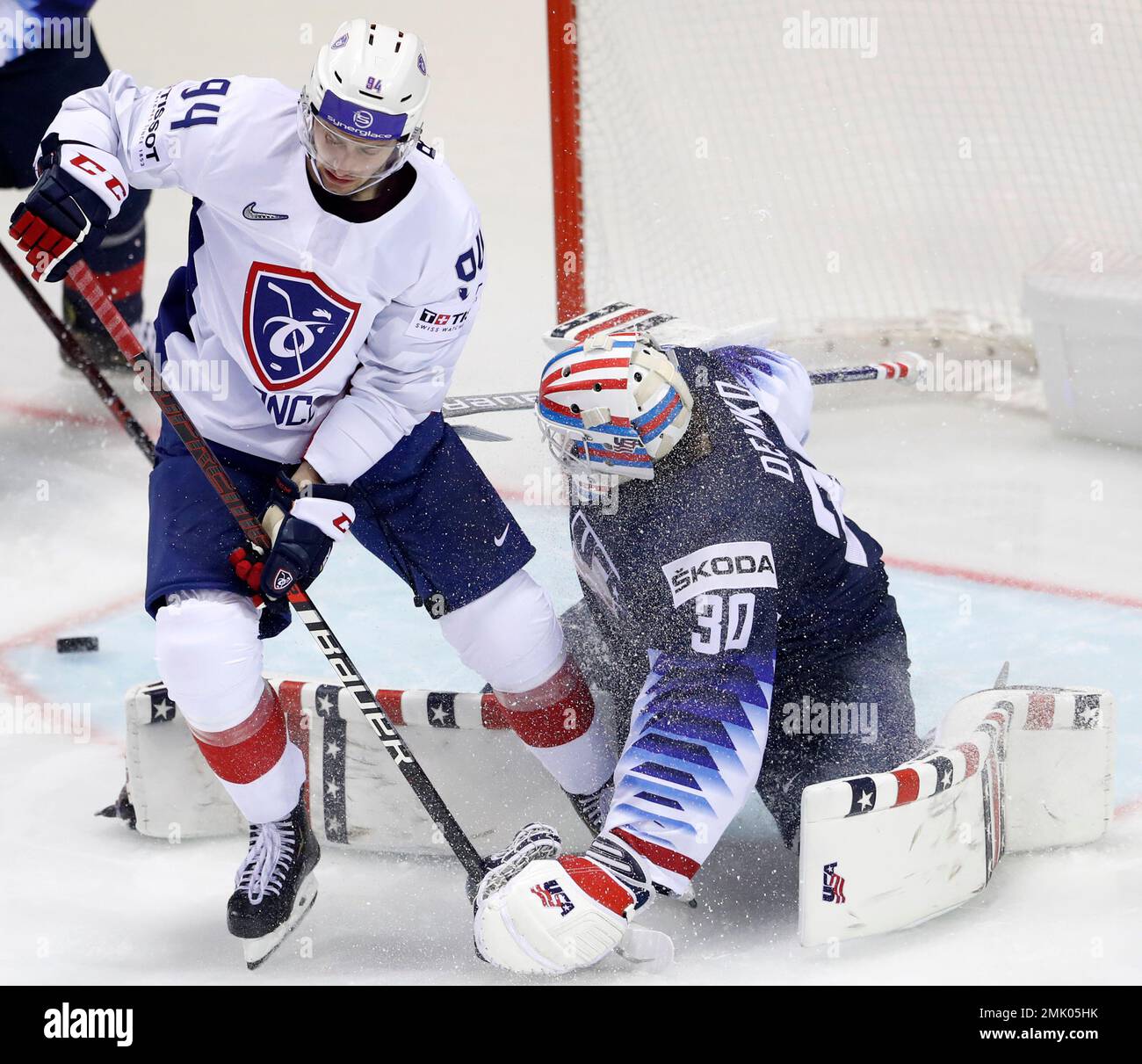 Goaltender Thatcher Demko of the US, right, makes a save against Tim ...