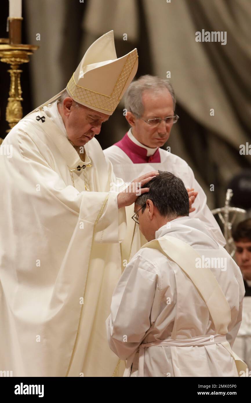 Pope Francis blesses a new priest during an ordination ceremony in St ...
