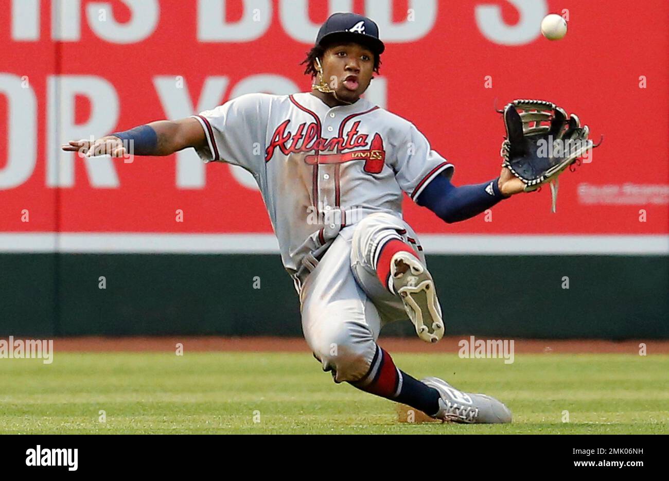 Atlanta Braves left fielder Ronald Acuna Jr. makes a sliding catch for ...
