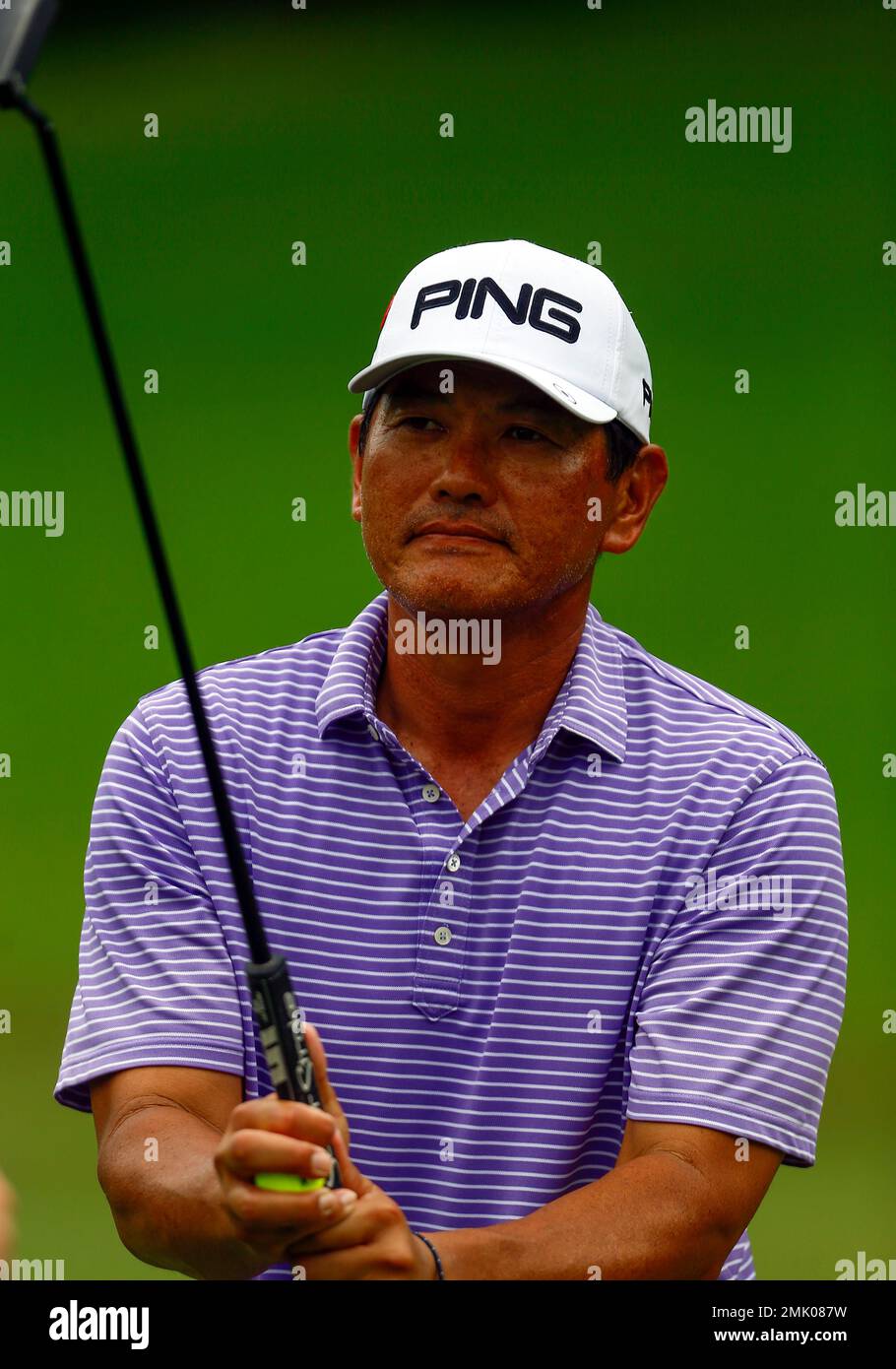 Ken Tanigawa walks off the green after putting on the first hole during ...