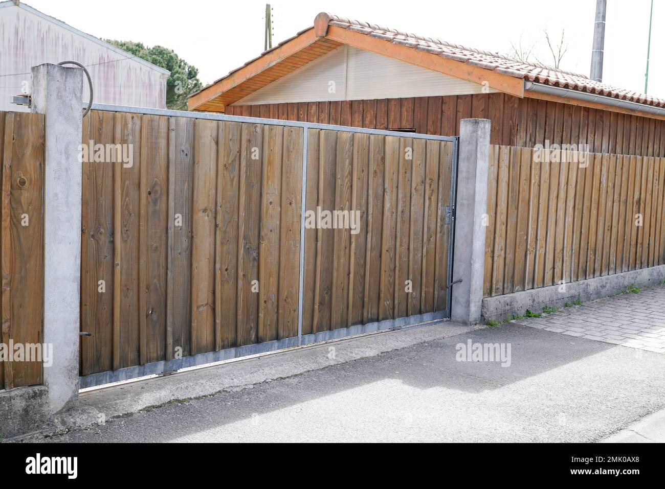 Brown wooden high sliding gate private house suburb wood portal access ...