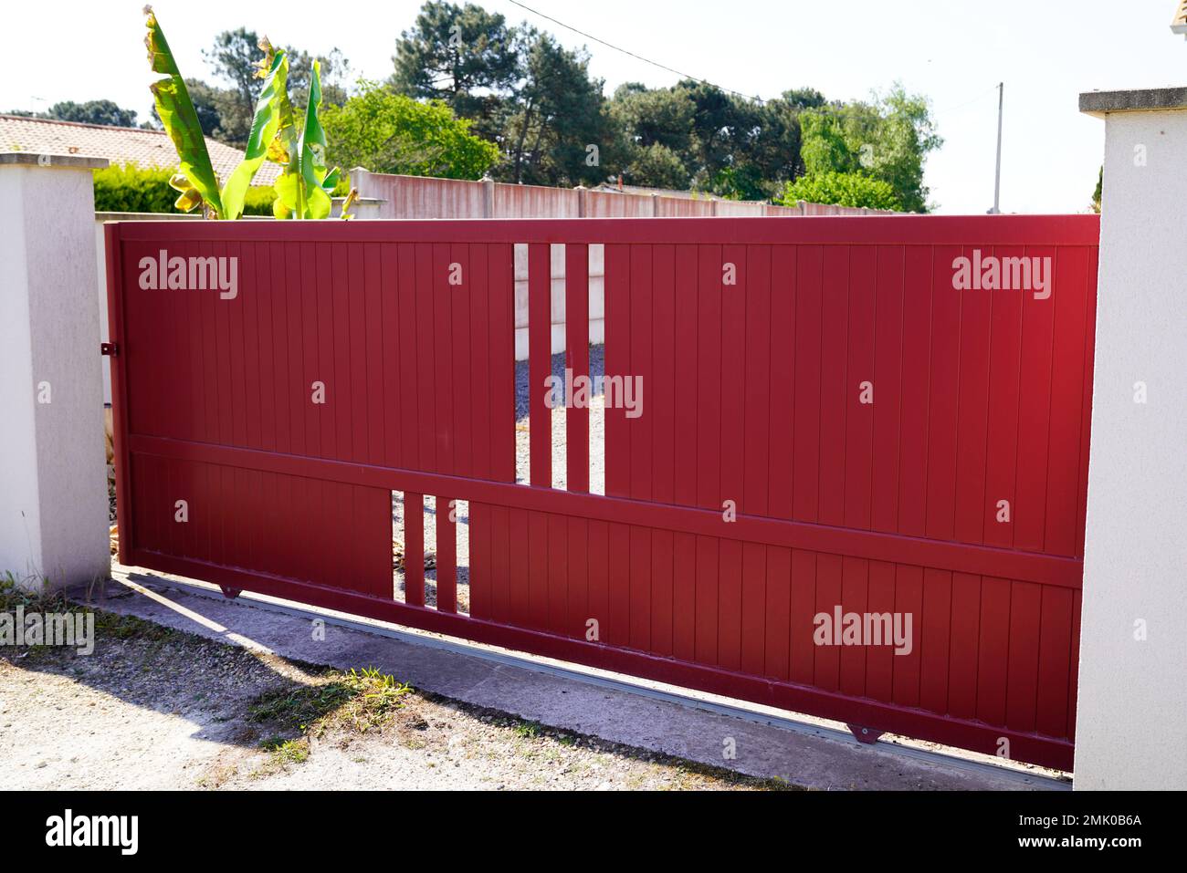 portal aluminum dark red metal gate of suburb house steel door Stock ...