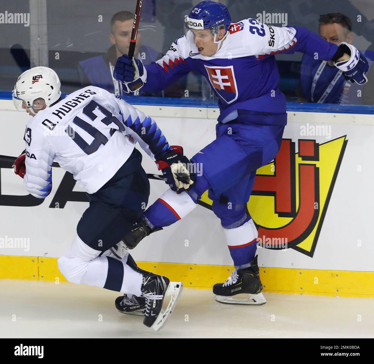 Slovakia's Adam Liska, right, challenges Quinn Hughes of the US, left ...