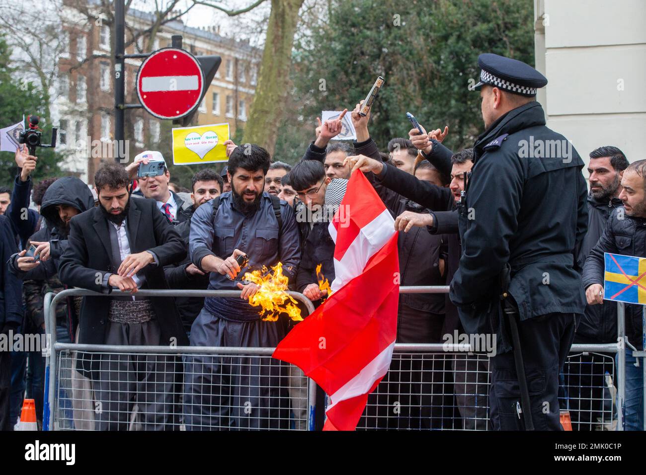 London, England, UK. 28th Jan, 2023. Muslim protesters burn Swedish and ...