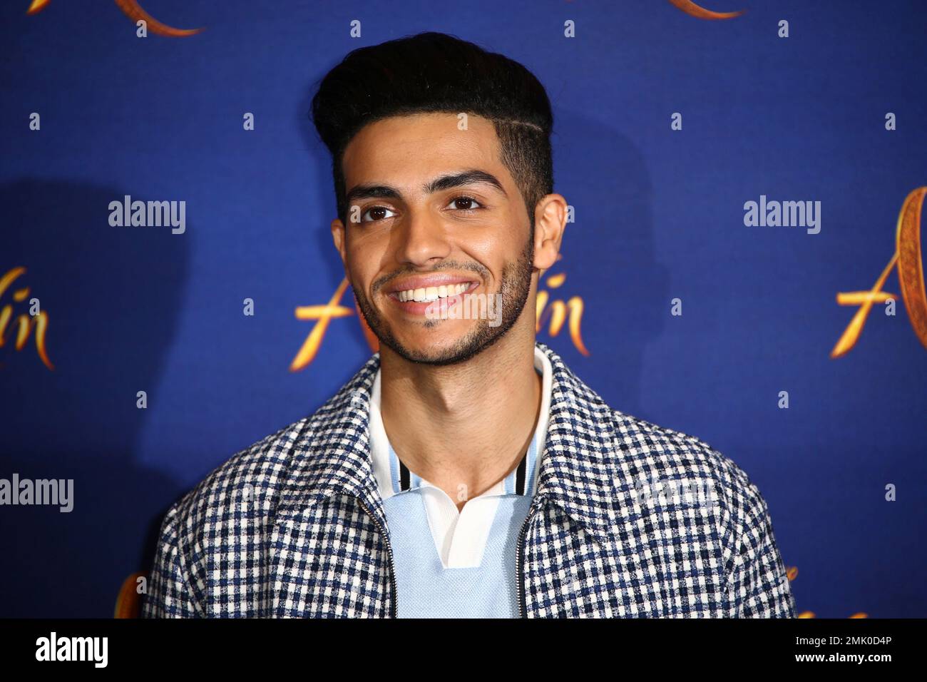 Actor Mena Massoud poses for photographers at the photo call for the ...