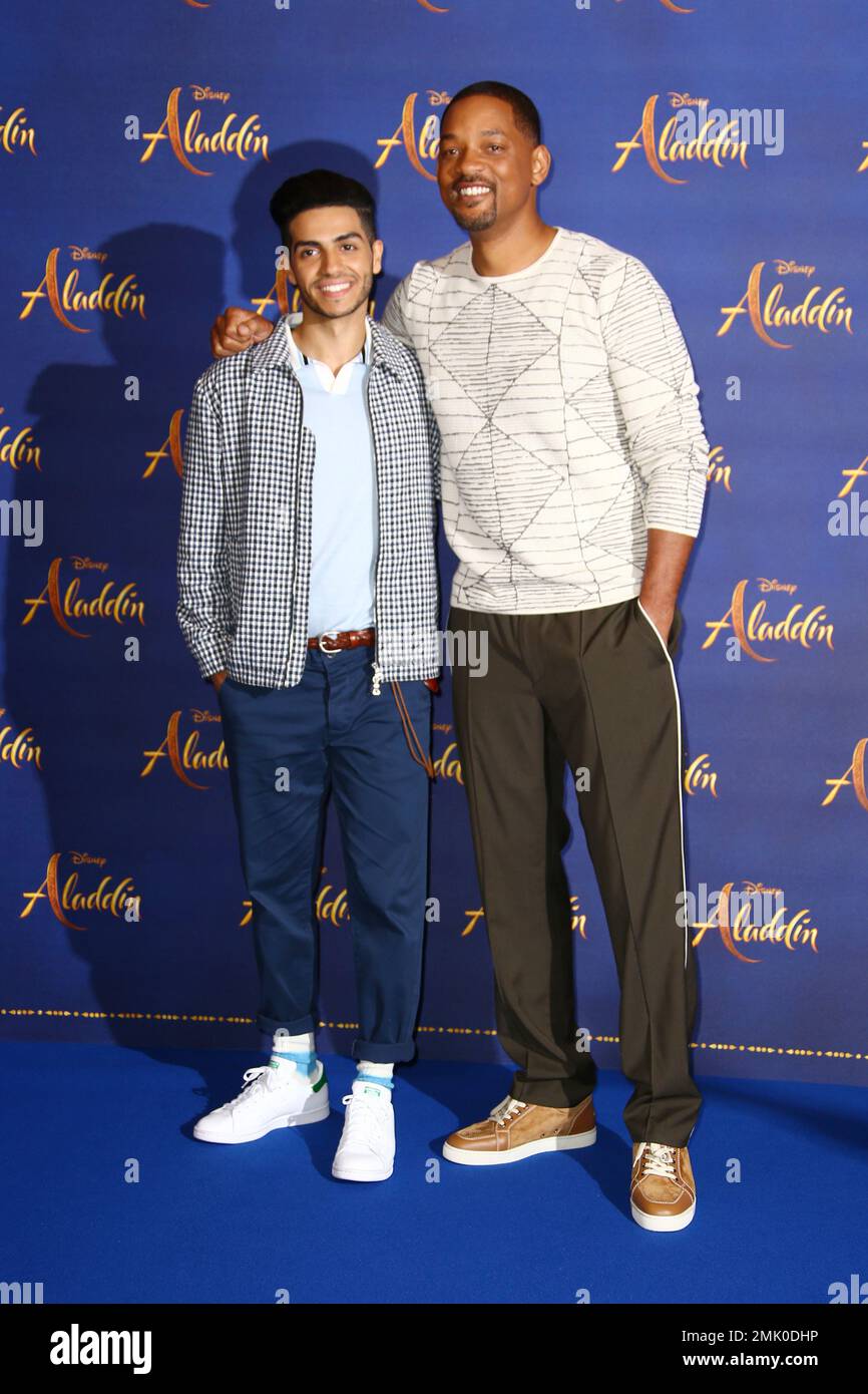 Actors Mena Massoud, left, and Will Smith pose for photographers at the ...