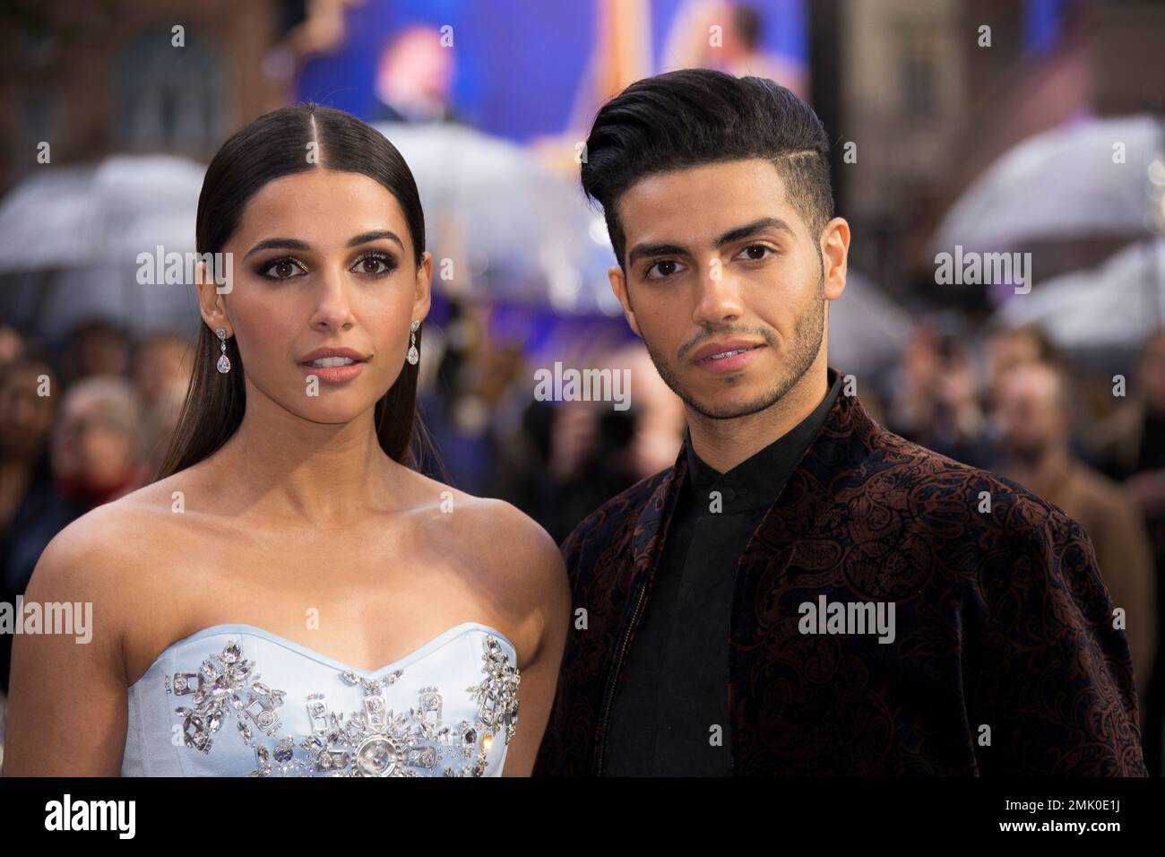Actors Naomi Scott, left and Mena Massoud pose for photographers upon ...