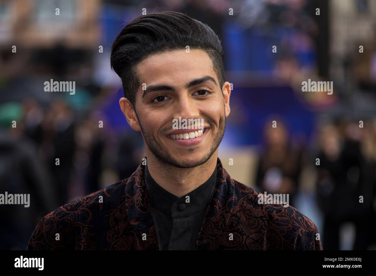 Actor Mena Massoud poses for photographers upon arrival at the 'Aladdin ...