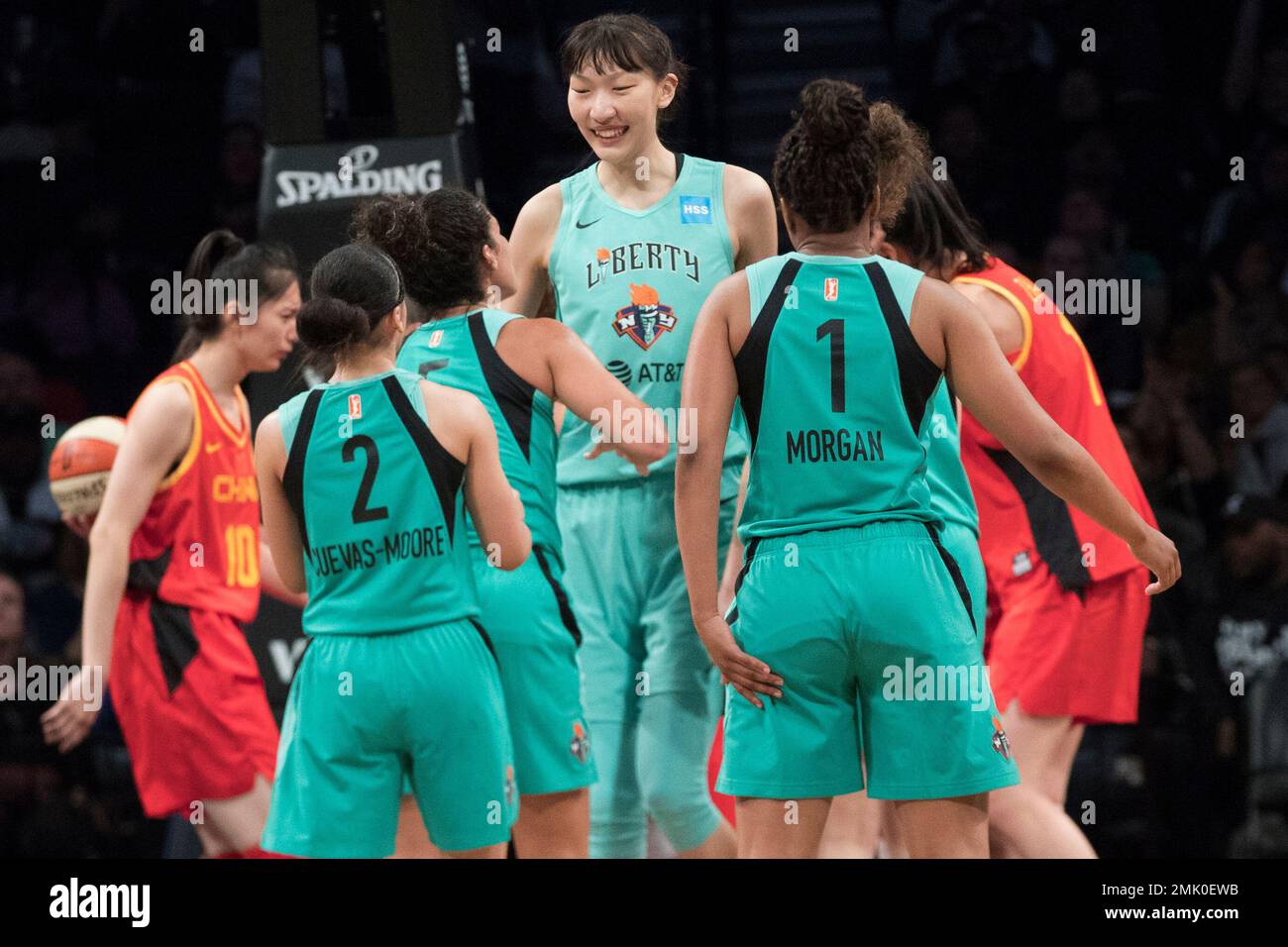 New York Liberty center Han Xu, center, celebrates her goal with her ...