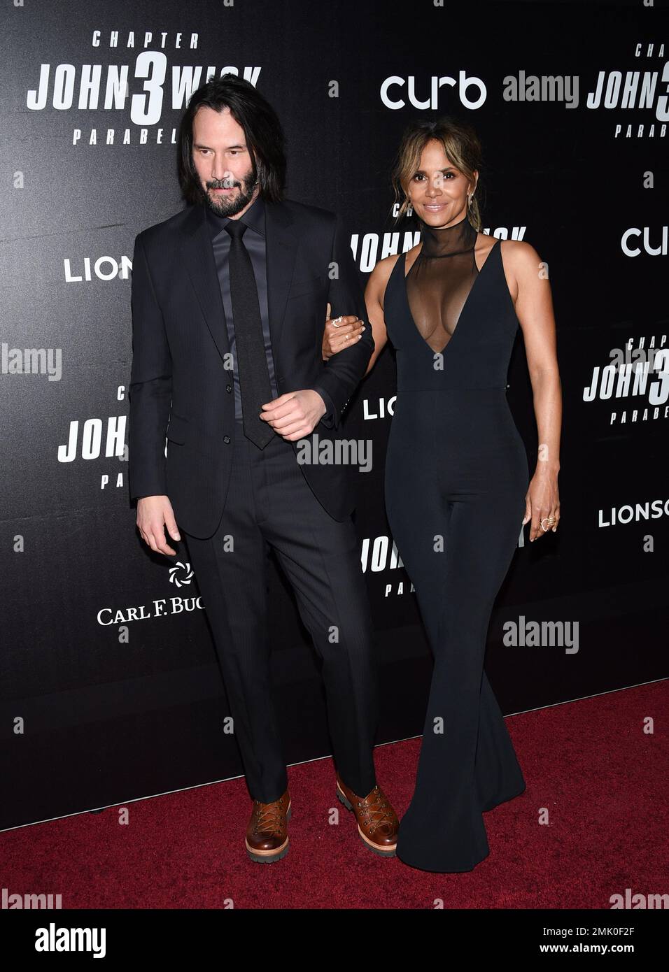 Actors Keanu Reeves, left, and Halle Berry attend the world premiere of ...