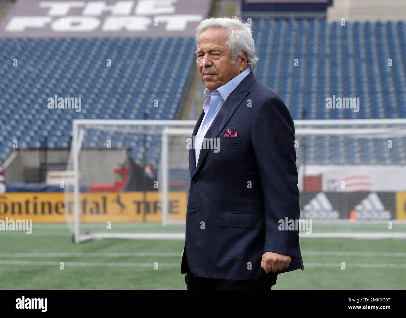New England Patriots owner Robert Kraft steps onto a podium before ...