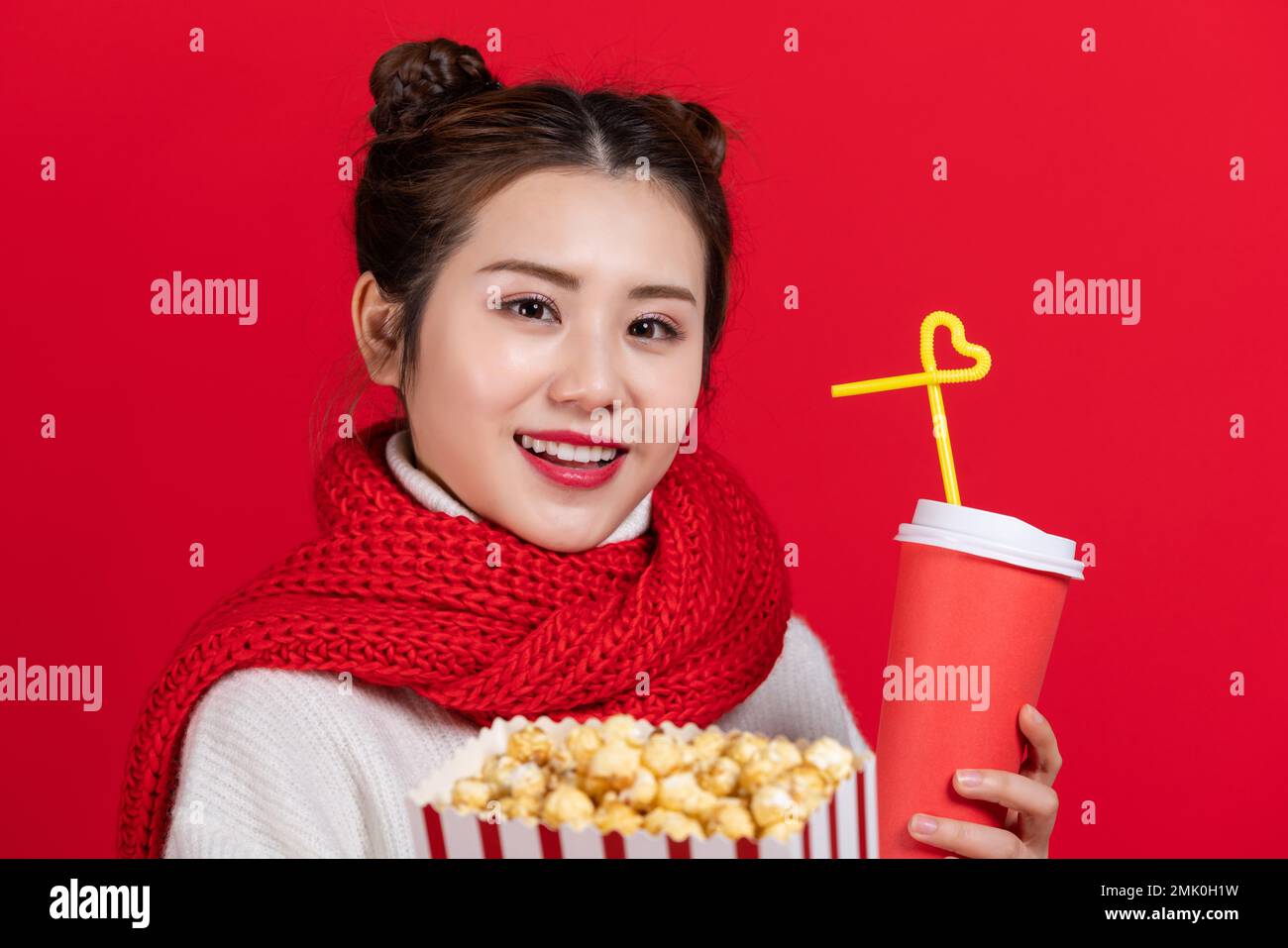 Woman popcorn standing hi-res stock photography and images - Alamy