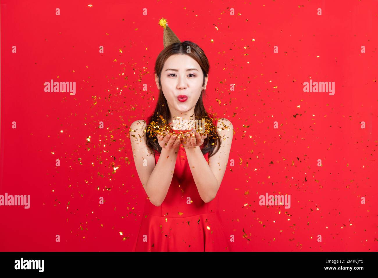 Happy young woman holding fireworks Stock Photo - Alamy