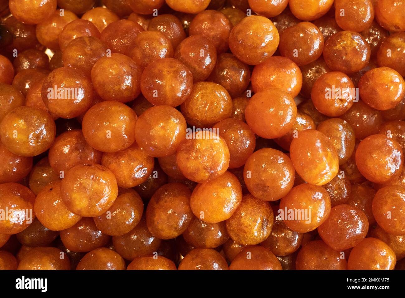 orange candied mandarin fruits background Stock Photo - Alamy