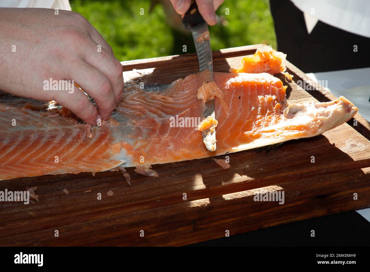smoked fresh salmon cut by cook chef Stock Photo - Alamy