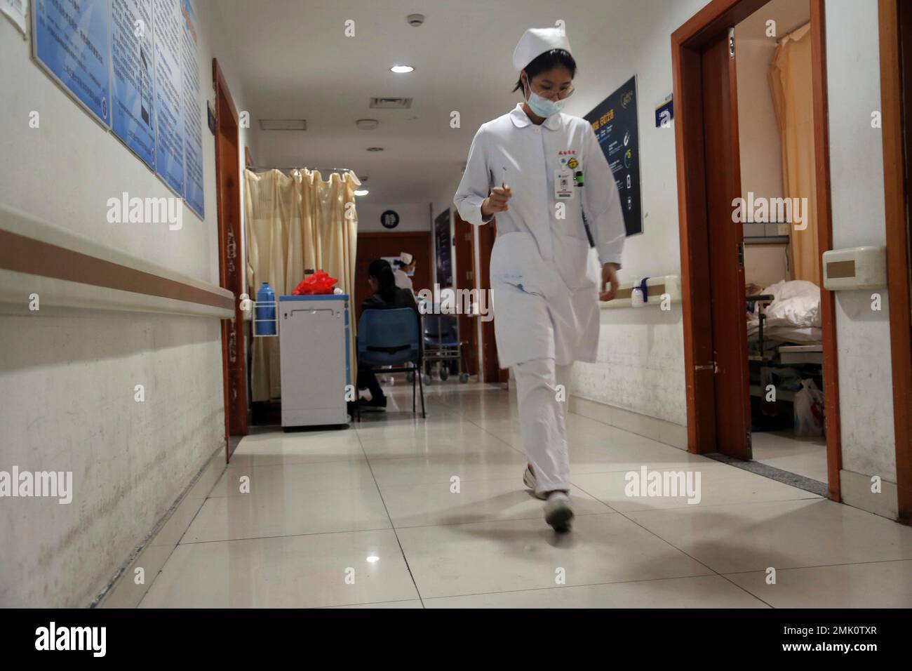 A nurse walks through the functional neurosurgery center at Shanghai's ...
