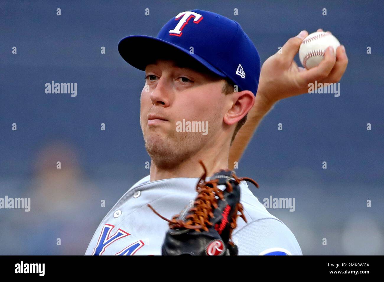 Texas Rangers starting pitcher Adrian Sampson delivers during the first ...