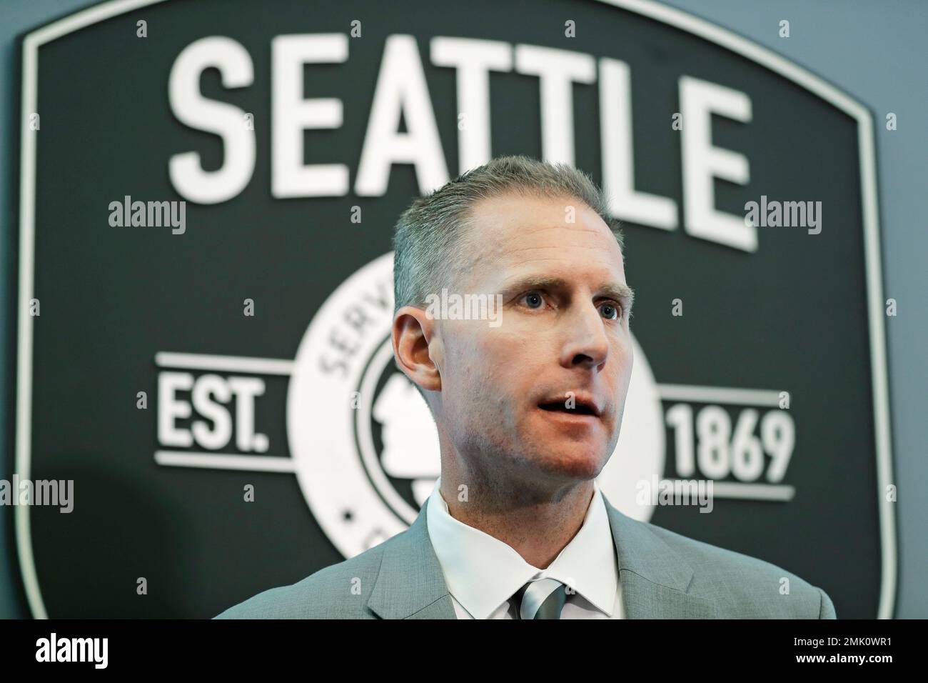 Seattle Police homicide Detective Rolf Norton talks to reporters about ...