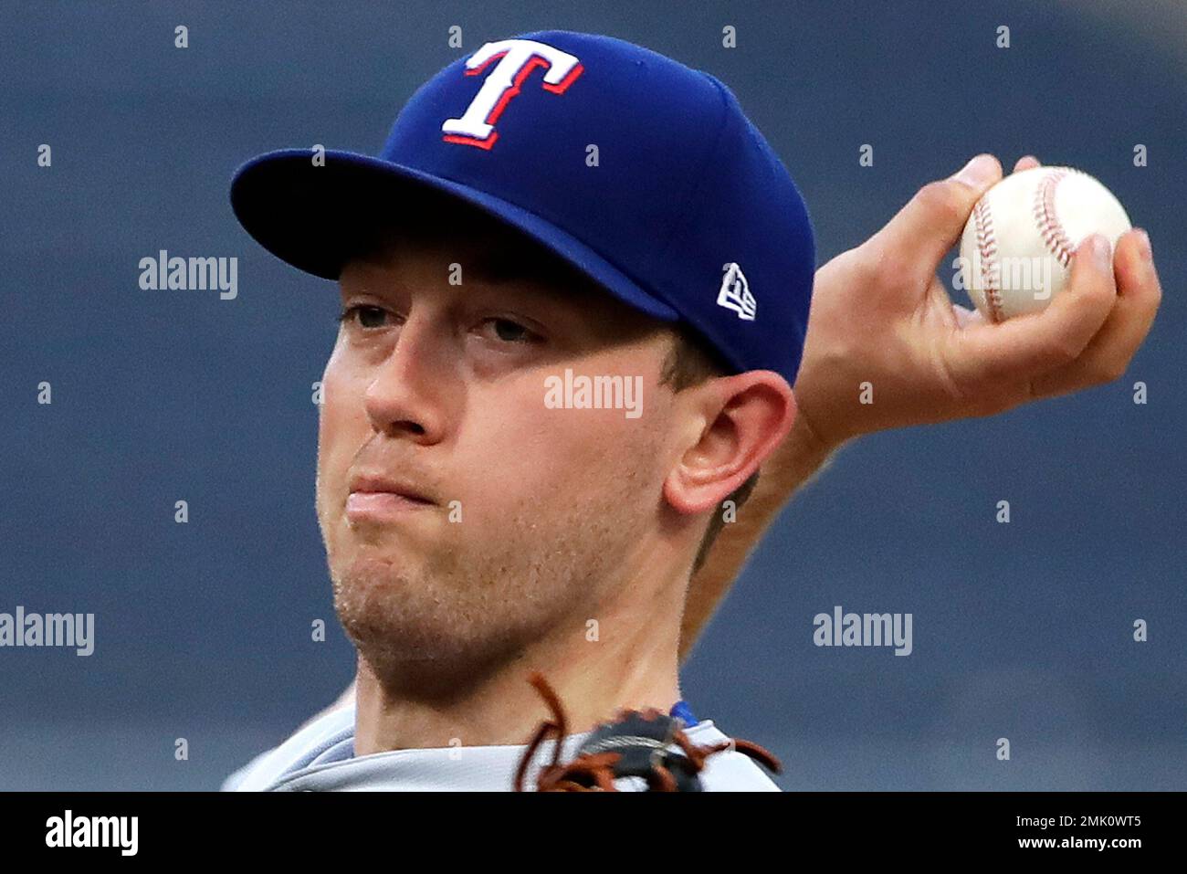Texas Rangers starting pitcher Adrian Sampson delivers during the first ...