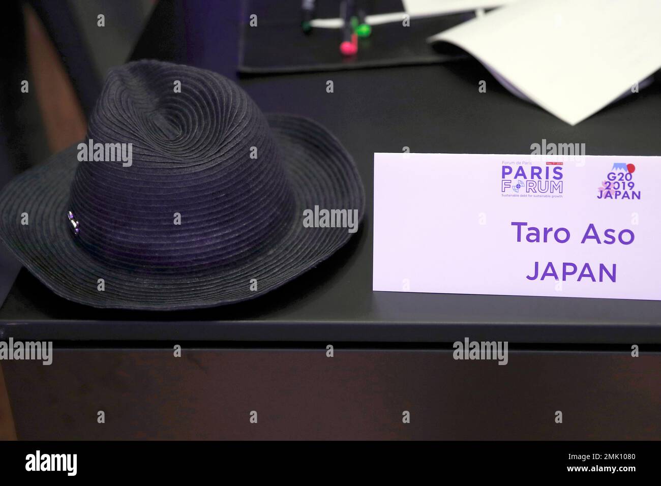 The hat of Japan's Finance Minister Taro Aso is left on his desk during ...