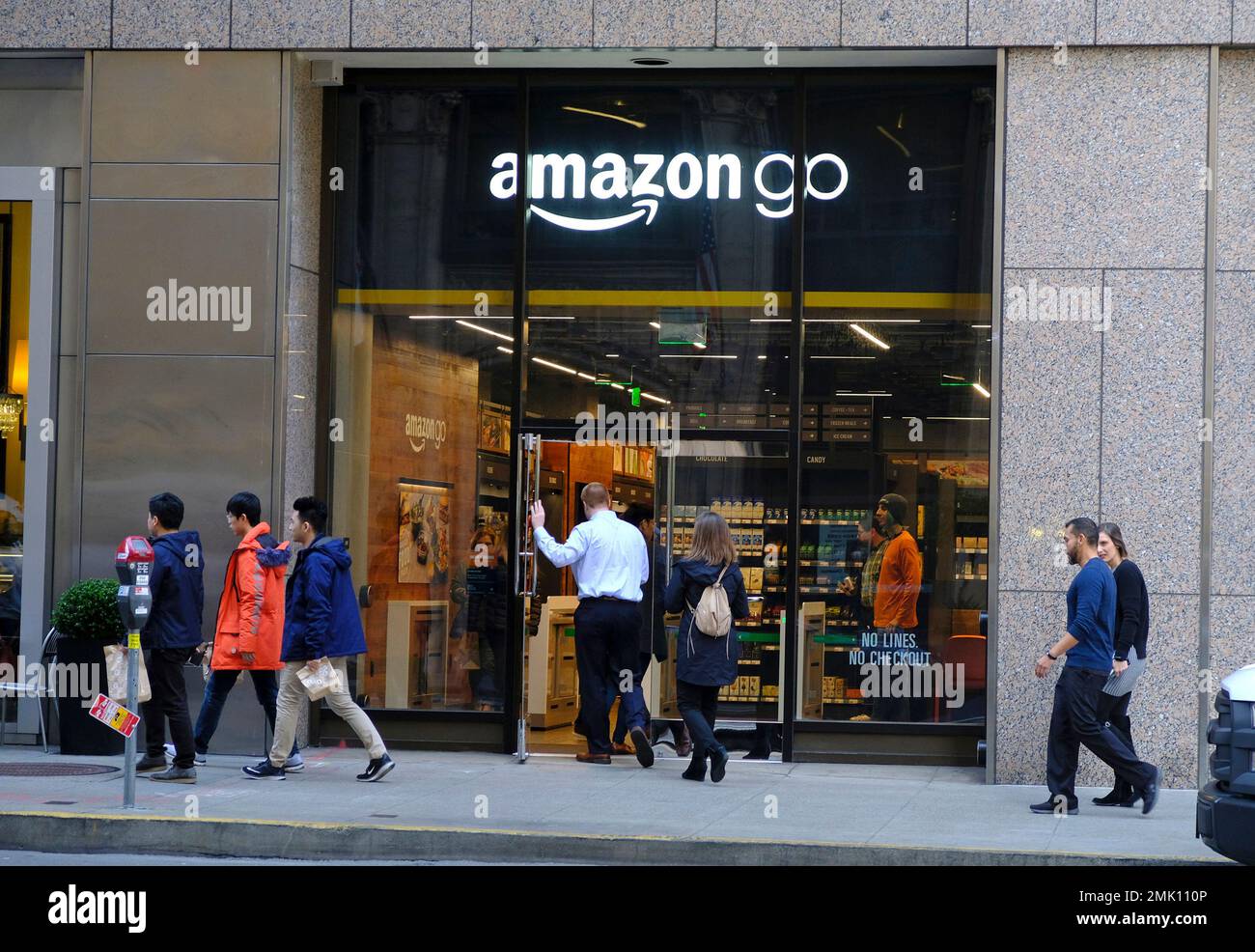 FILE - In this Jan. 30, 2019, file photo people walk past and into an ...