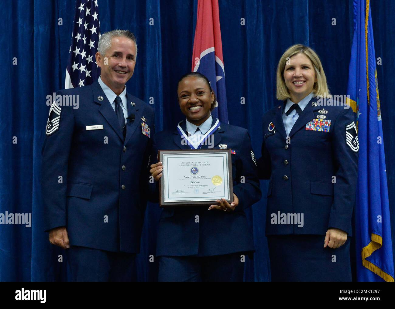 U.S. Air Force Staff Sgt. Anna Goss receives the Distinguished Graduate ...