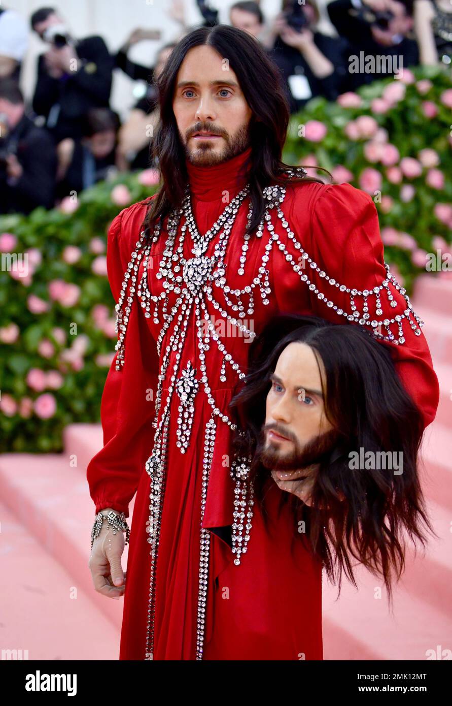 Jared Leto, holding a model of his head, attends The Metropolitan ...